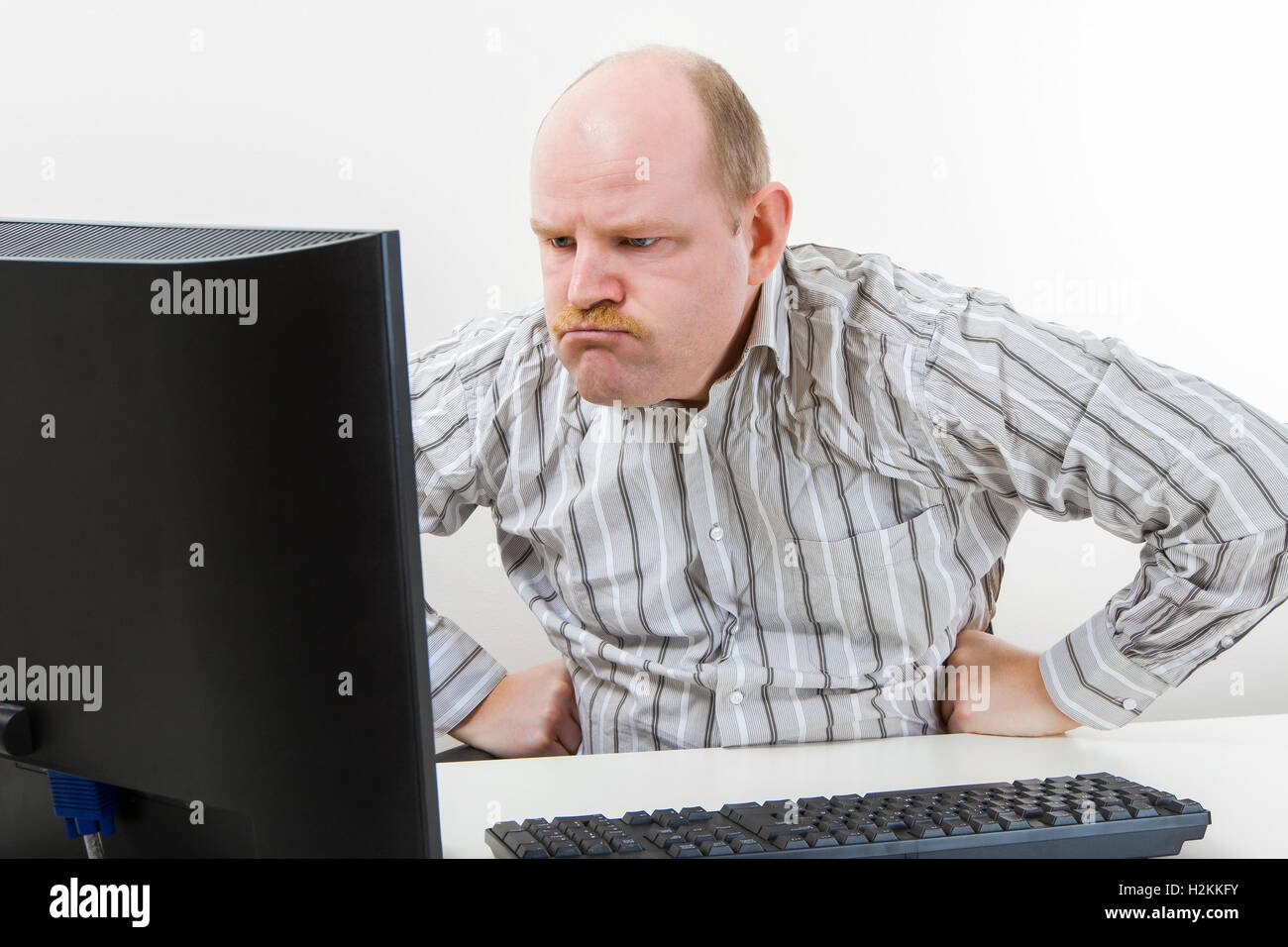 Angry Businessman Looking At Computer In Office Stock Photo - Alamy