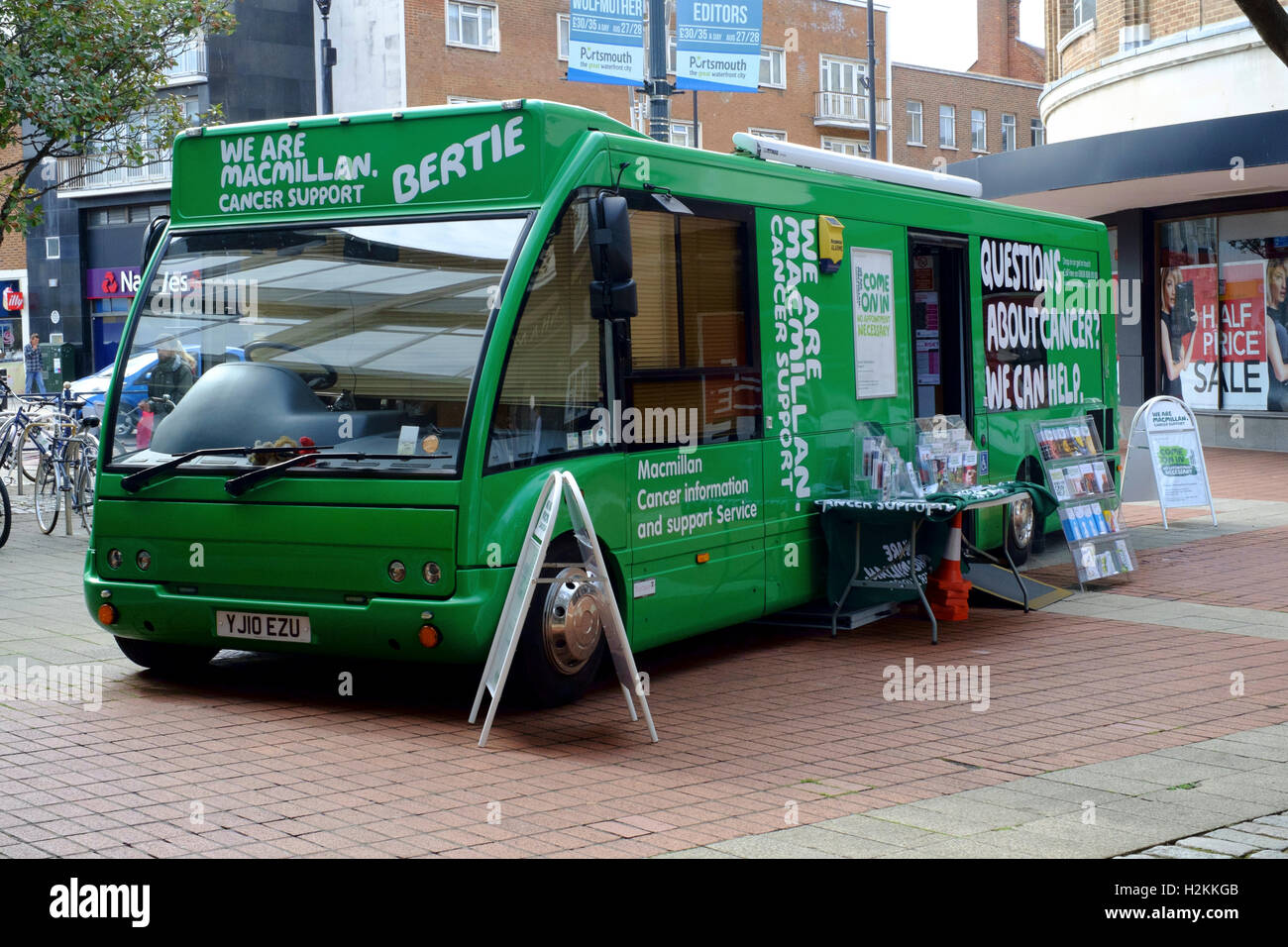 green macmillan cancer charity bus being used as a mobile information ...