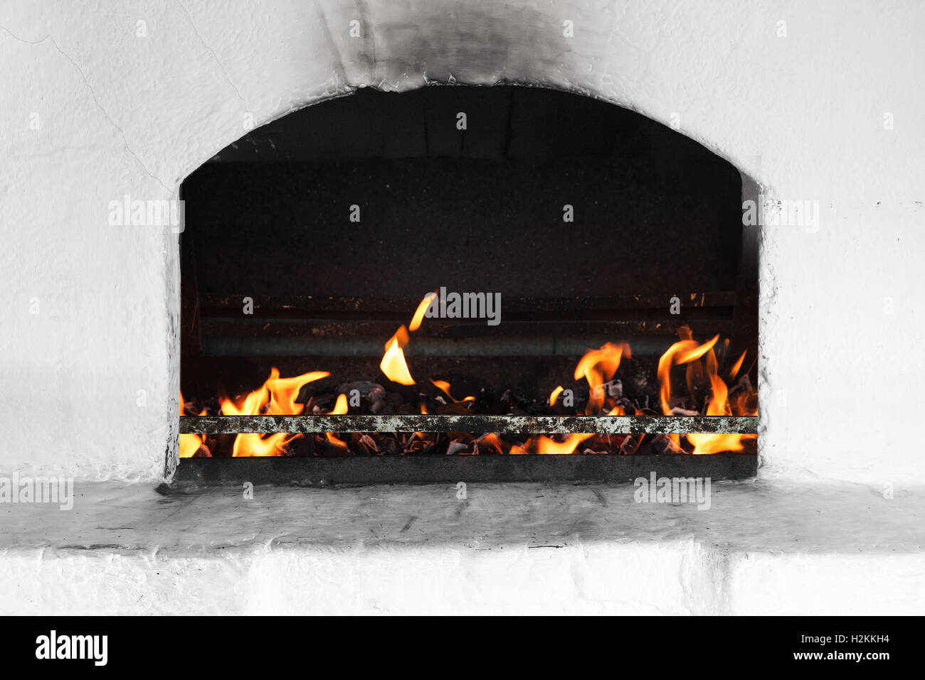 White Russian stove burner with fire inside Stock Photo - Alamy