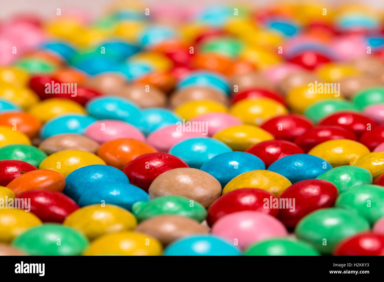 different colored covered with glaze candies closeup Stock Photo - Alamy