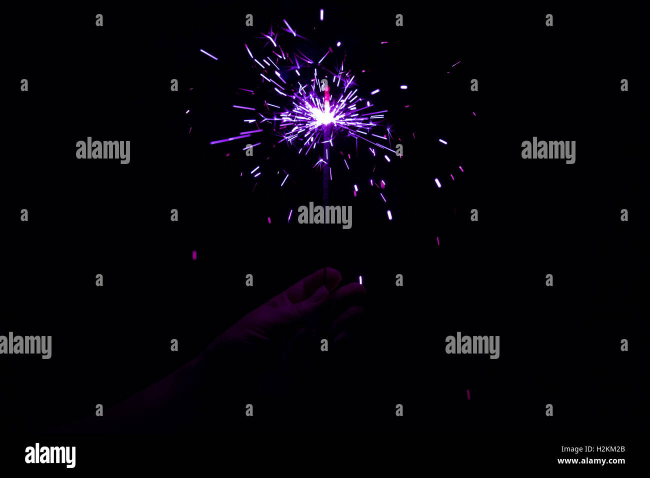magenta shine Bengal light on a black background Stock Photo - Alamy