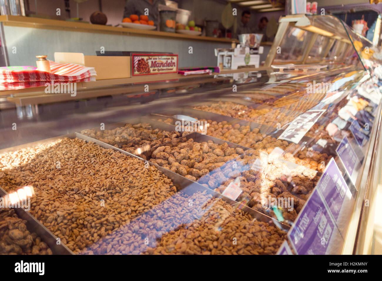 Various caramel nuts and dried fruits on a counter at oktoberfest ...