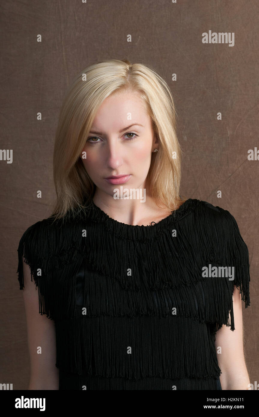Portrait of a serious young woman Stock Photo - Alamy