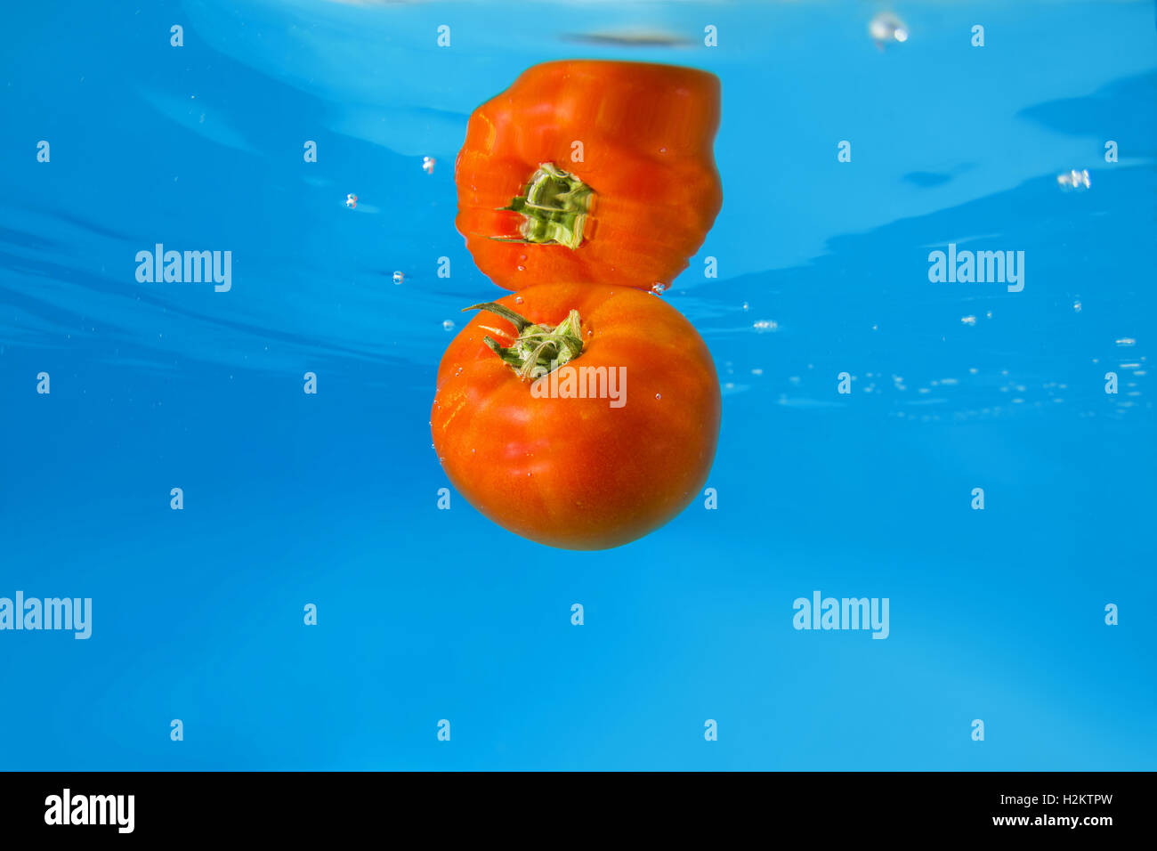 Odessa, Ukraine. 18th Sep, 2016. Tomato splashing in blue water ...