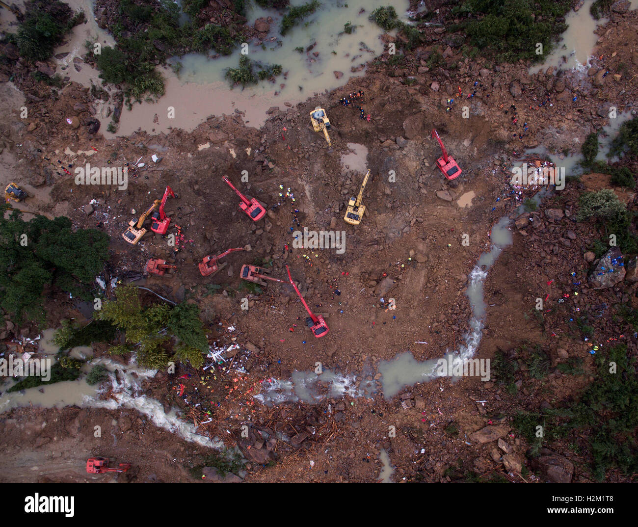 Lishui. 30th Sep, 2016. Rescuers work at the site of landslide in an ...