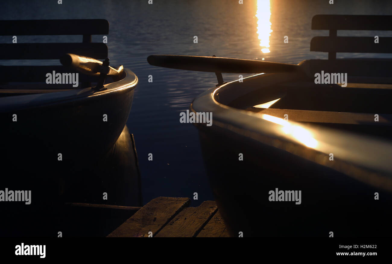 Aitrang, Germany. 29th Sep, 2016. Paddle boats lie in the evening sun ...