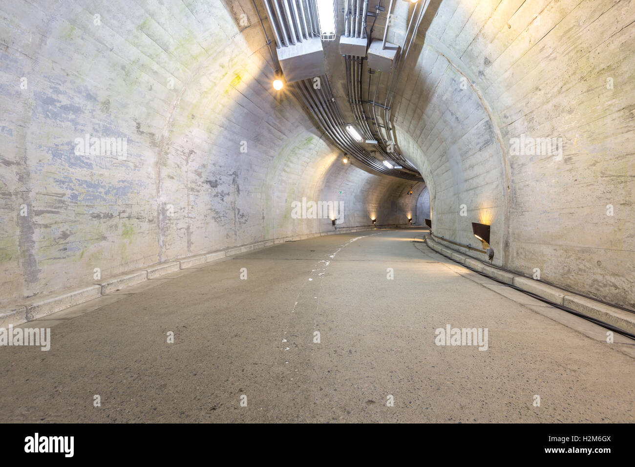 Interior of an urban walkway tunnel road Stock Photo - Alamy