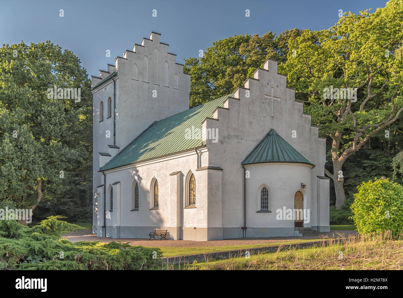 A typical swedish small white church located at the outskirts of the ...
