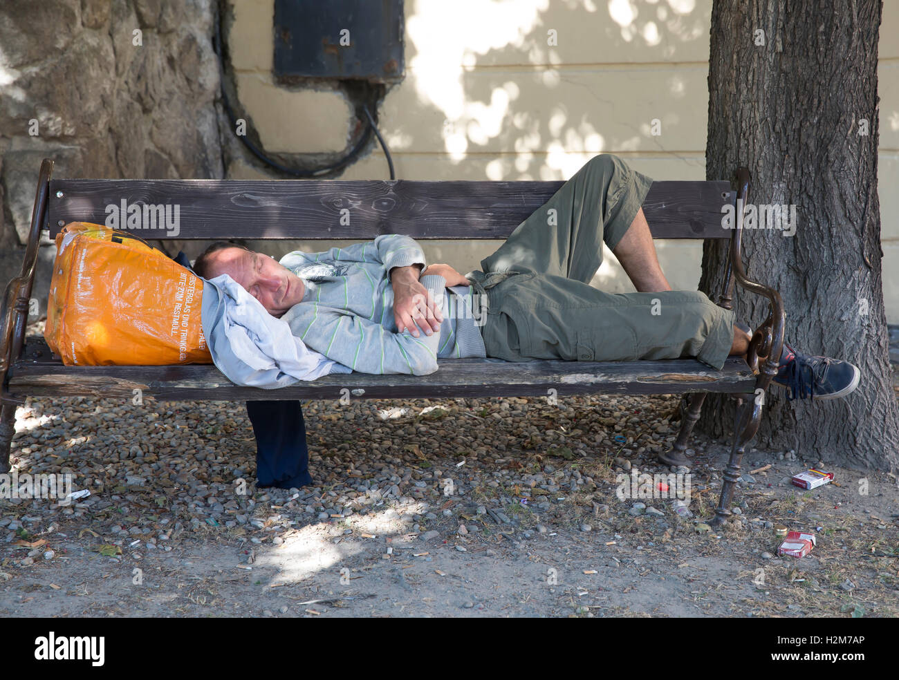 A homeless man asleep on a park bench in Bratislava Slovakia Stock ...