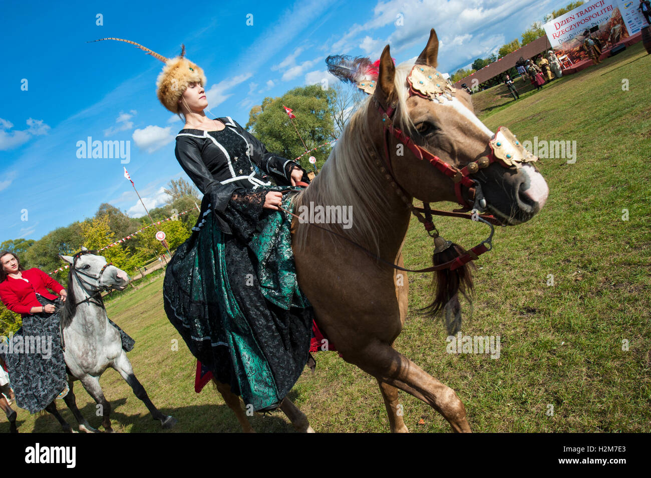 Horse riders in historical costumes during an open-air event in Pultusk ...