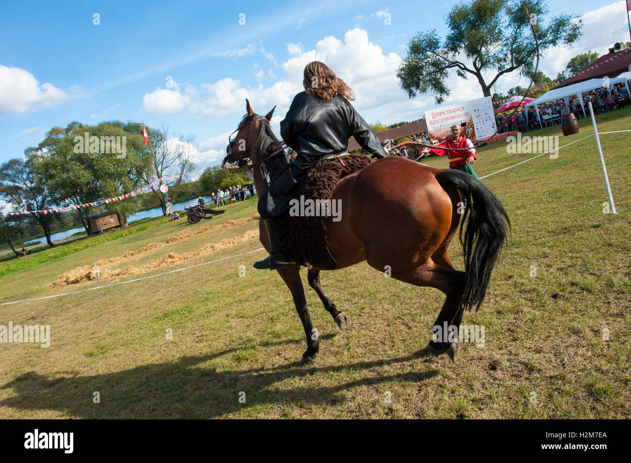 Horse riders in historical costumes during an open-air event in Pultusk ...