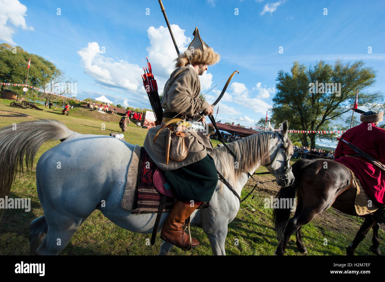 Horse riders in historical costumes during an open-air event in Pultusk ...