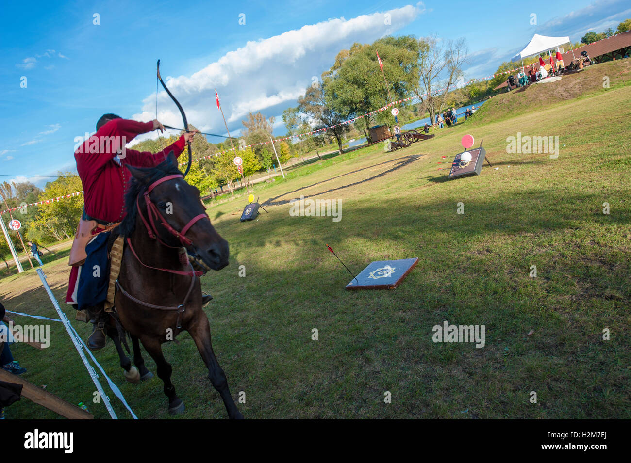 Horse riders in historical costumes during an open-air event in Pultusk ...