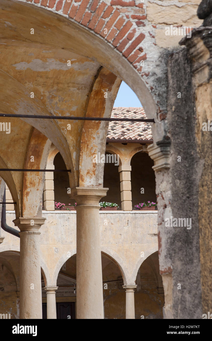 Inner court in old building with arches Stock Photo - Alamy