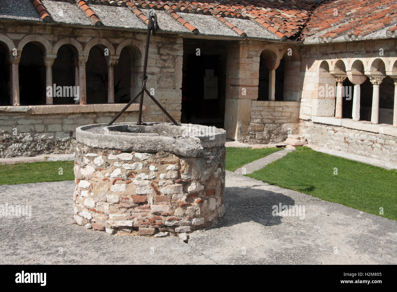 An old well inside one ancient cloister Stock Photo - Alamy