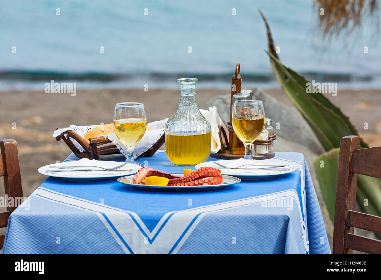 Table for two in the restaurant on the beach Stock Photo - Alamy