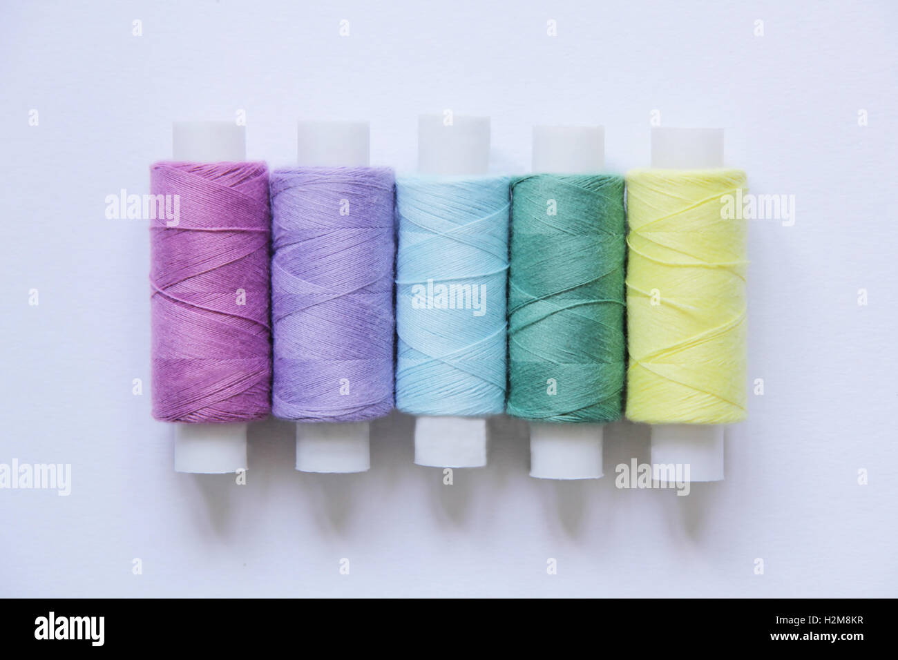 Sewing threads of different colors in beautiful pattern Stock Photo - Alamy