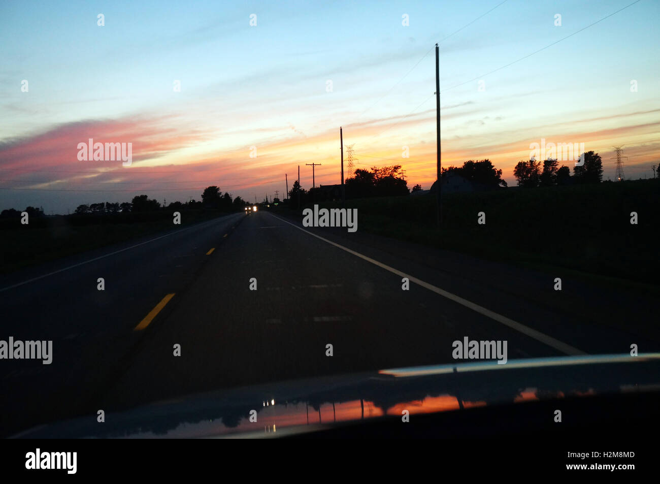 Sunset from the highway Stock Photo - Alamy