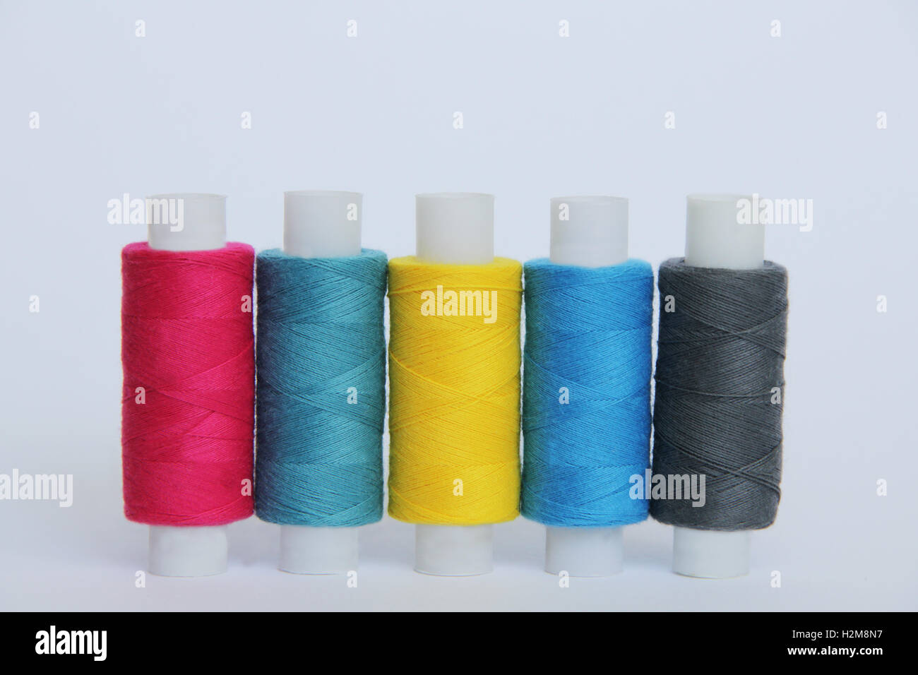Sewing threads of different colors in beautiful pattern Stock Photo - Alamy