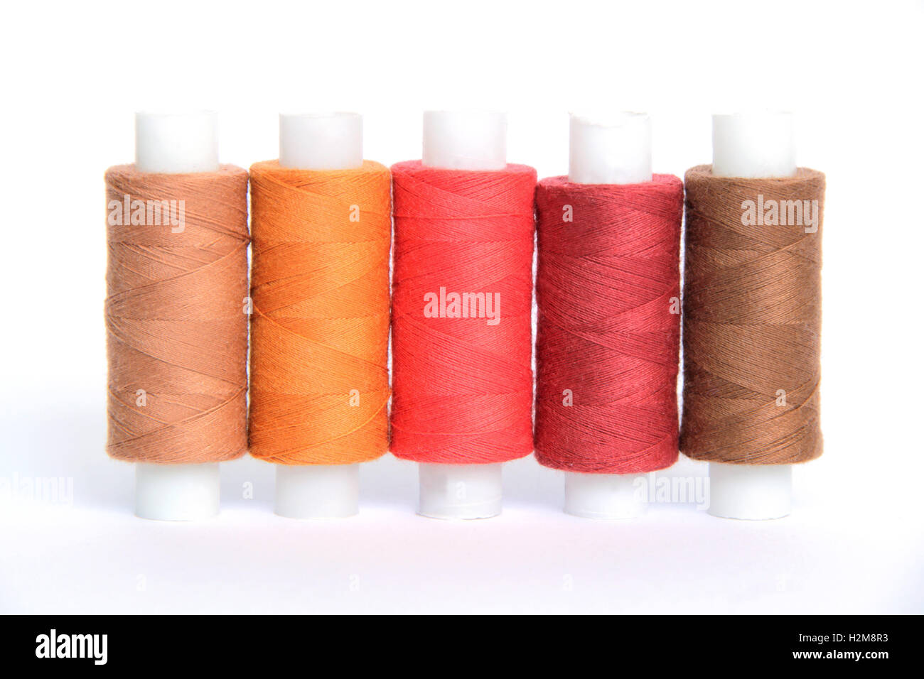 Sewing threads of different colors in beautiful pattern Stock Photo - Alamy