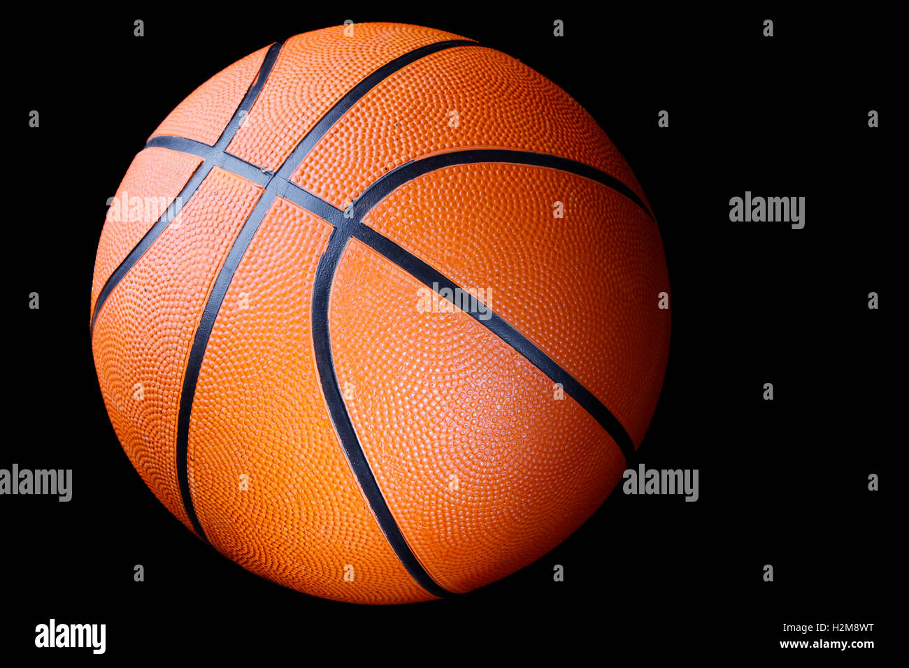 One basketball on dark background Stock Photo - Alamy