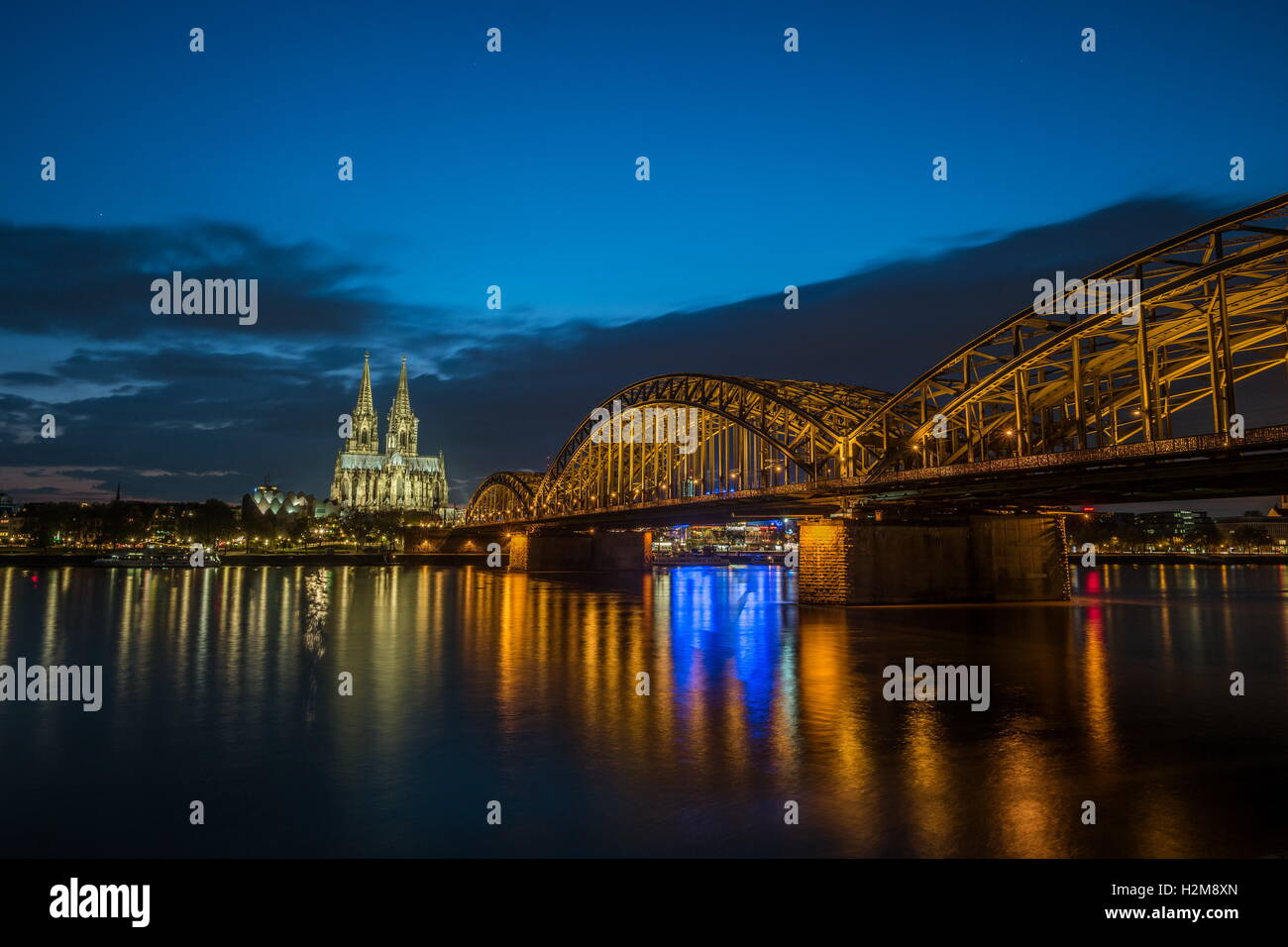 Sunset view of Cologne Cathedral and Hohenzollern Bridge Stock Photo ...