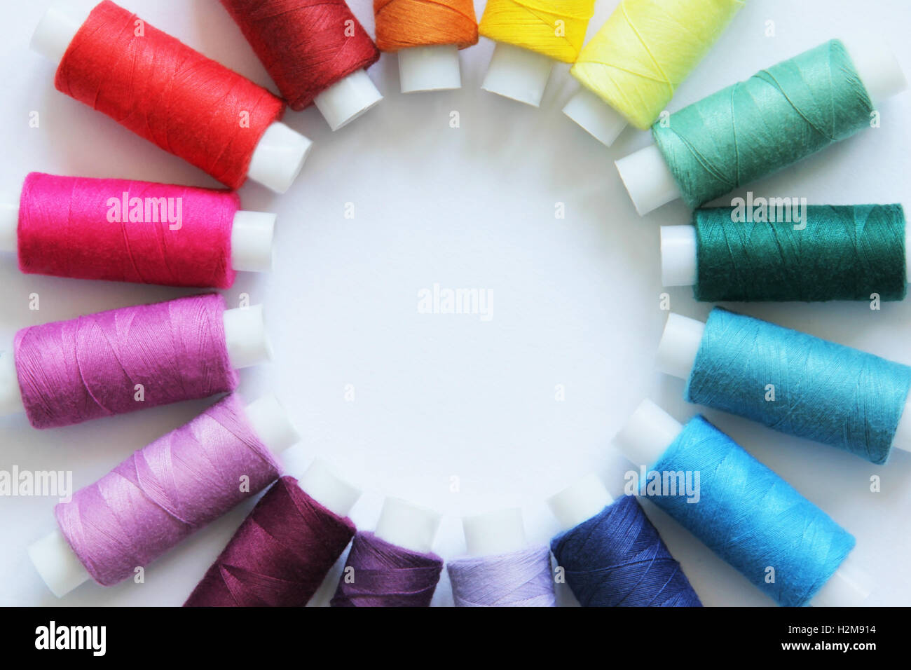 Sewing threads of different colors in beautiful pattern Stock Photo - Alamy