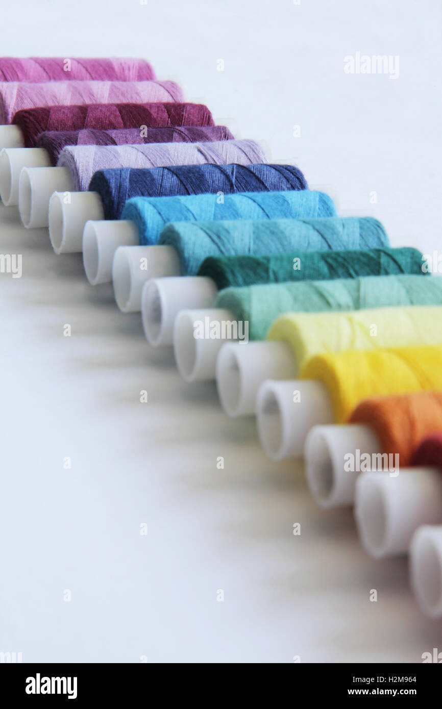 Sewing threads of different colors in beautiful pattern Stock Photo - Alamy