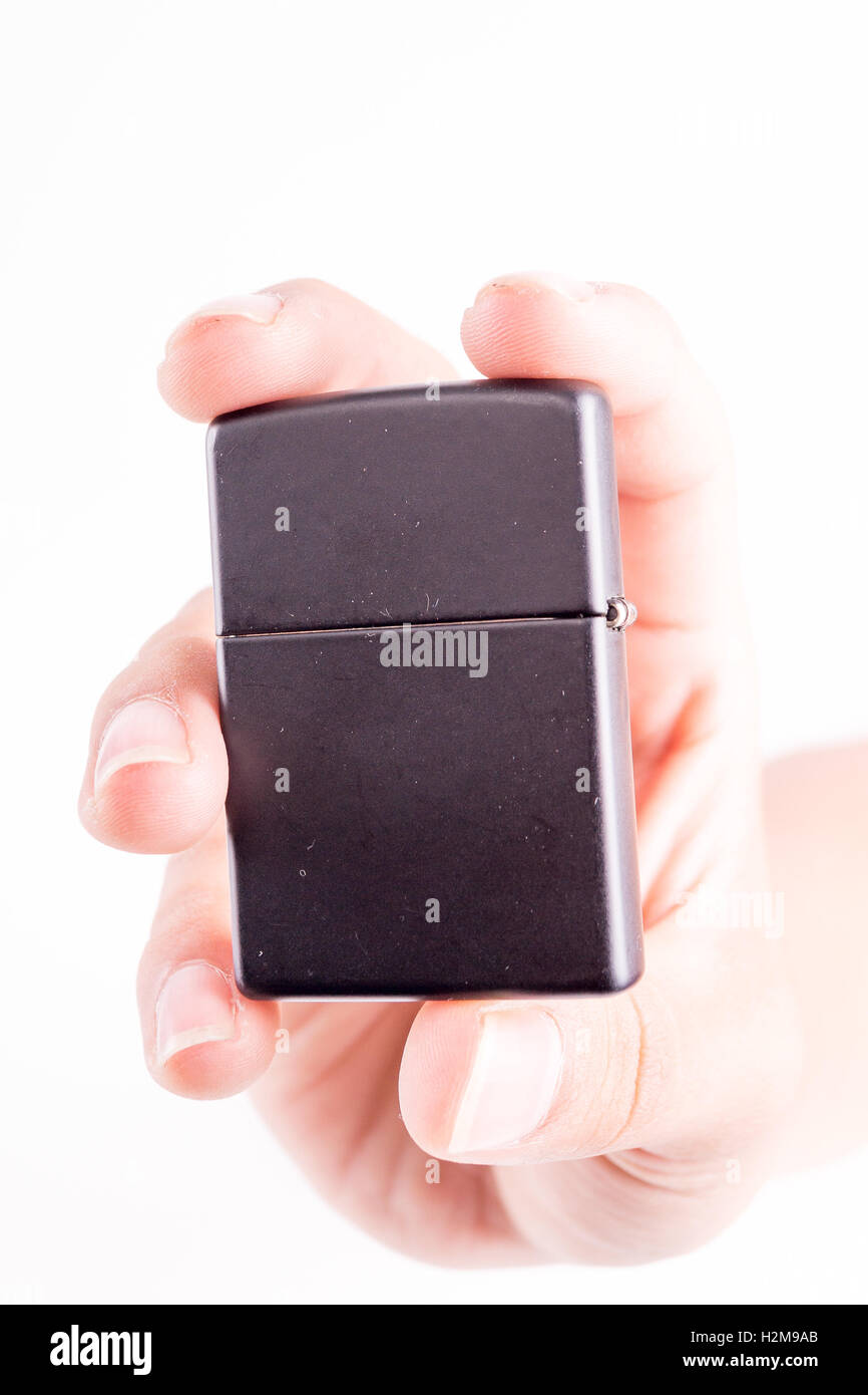 Hand hold holding lighter, on white background Stock Photo - Alamy