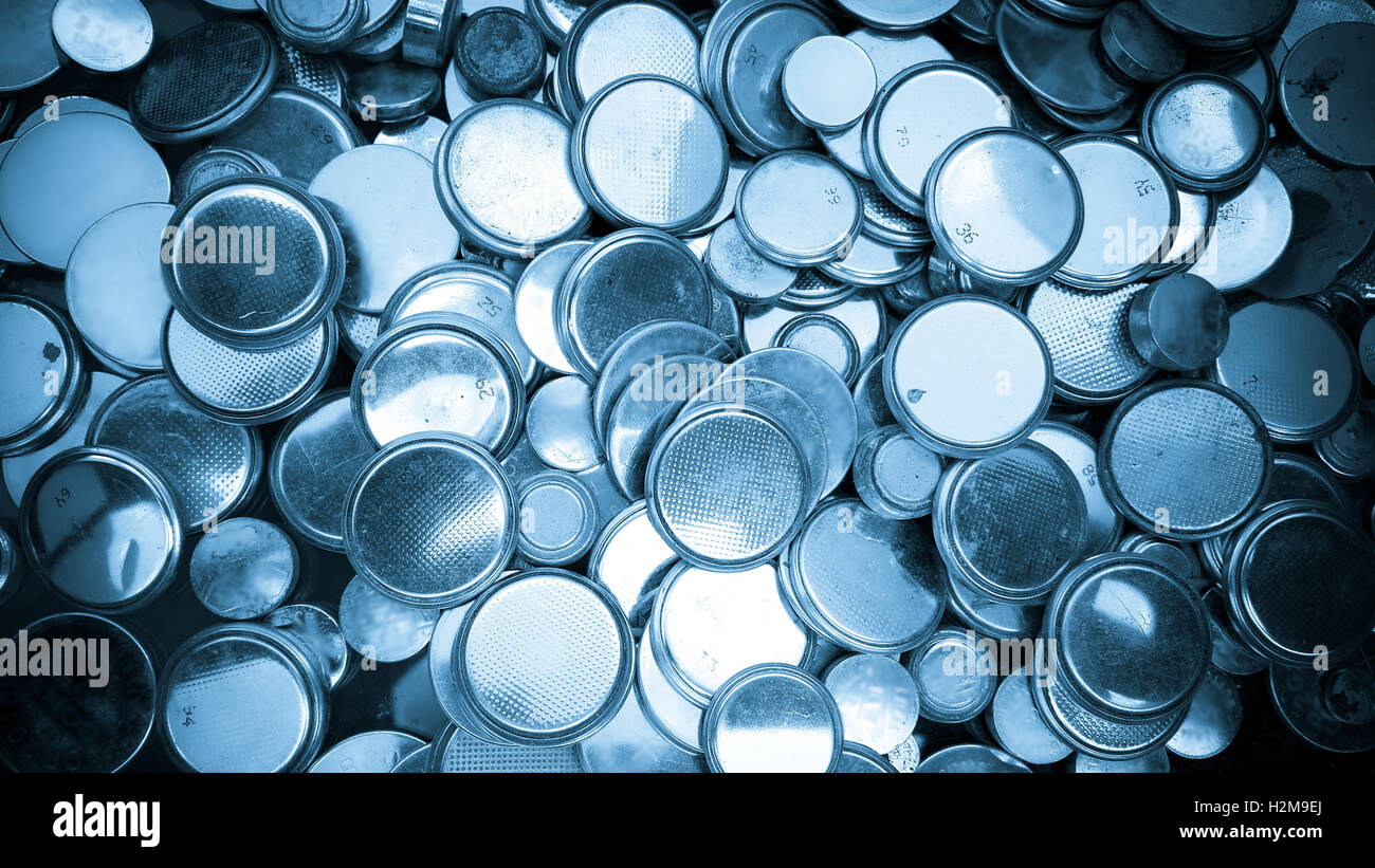 Lithium batteries of various sizes background blue toned Stock Photo ...