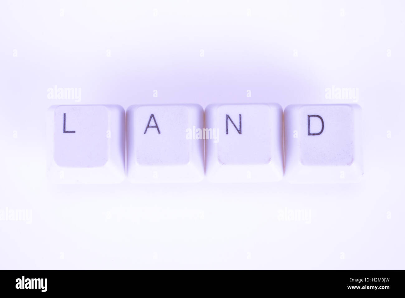 Land word written with computer buttons Stock Photo - Alamy