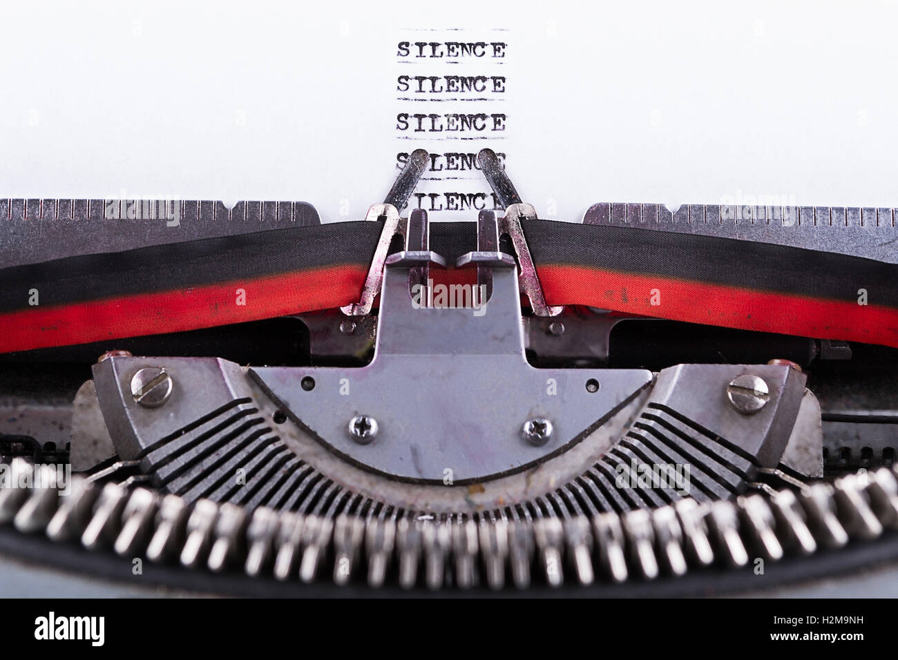 Silence written on an old typewriter Stock Photo - Alamy