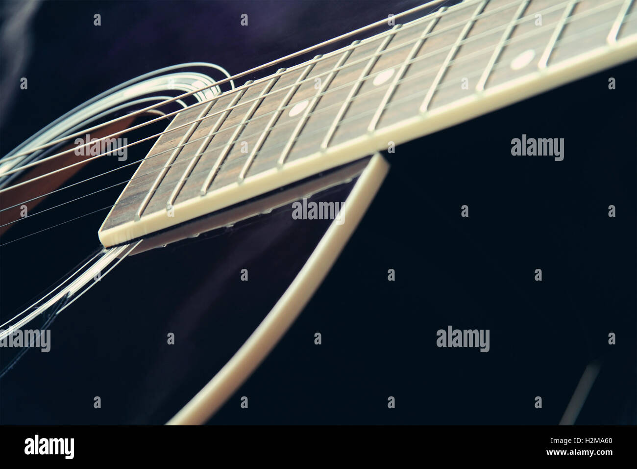 Guitar acoustic in vintage style close up photo Stock Photo - Alamy