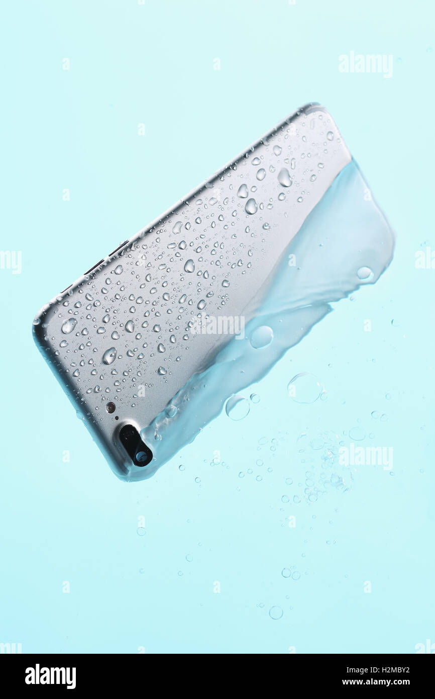 Waterproof smartphone covered with water Stock Photo - Alamy
