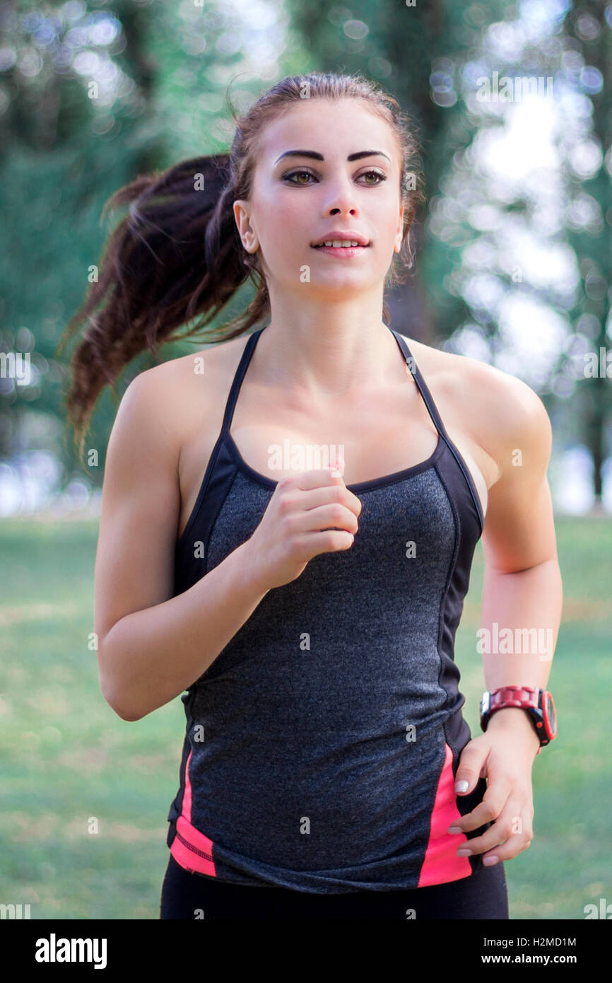 Young fitness girl runs during training workout outdoor Stock Photo - Alamy