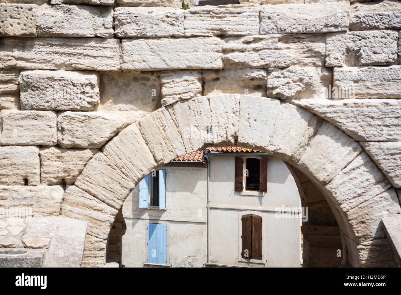 Street scene in the town of Arles, France with traditional stone ...