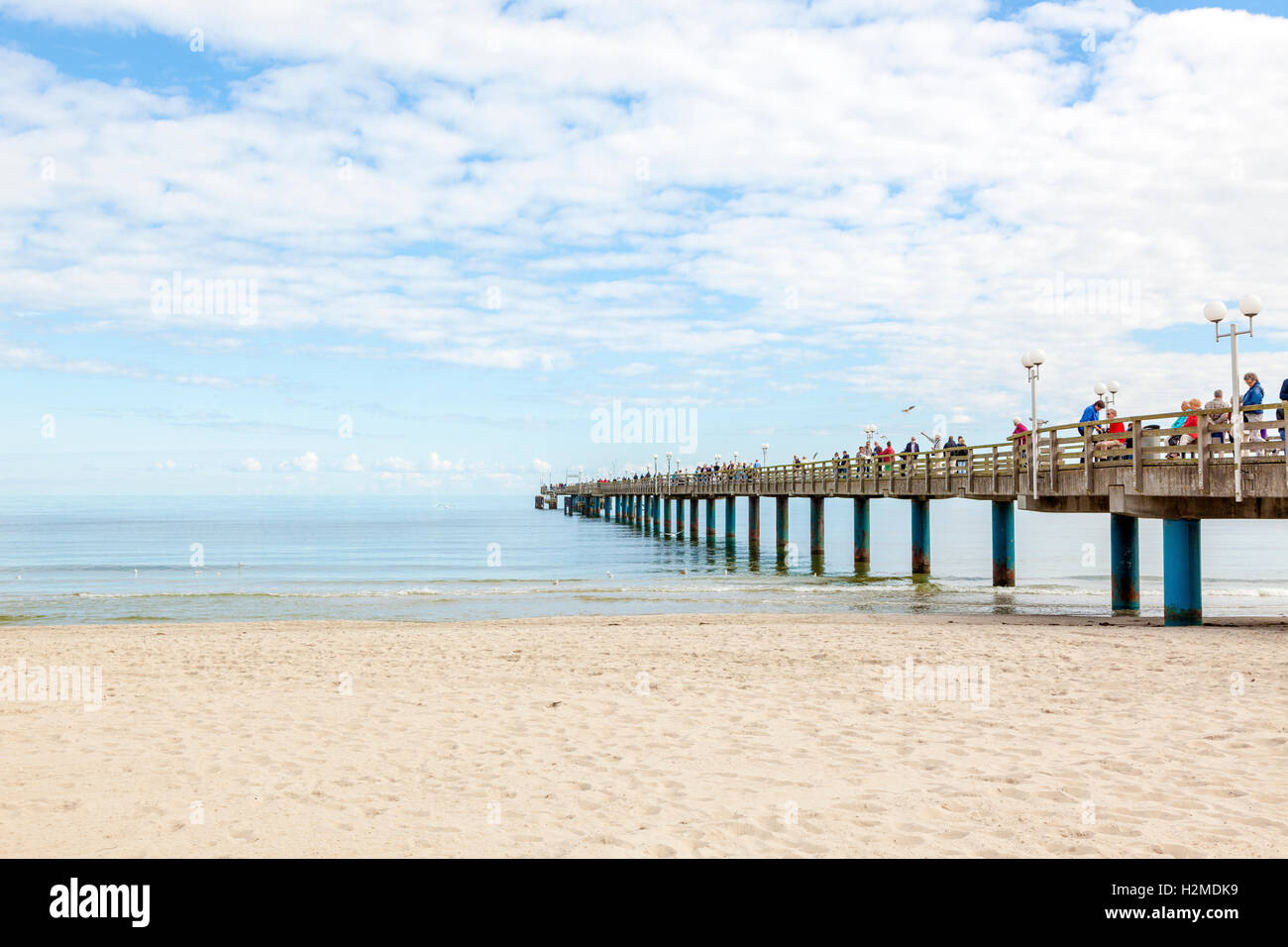 Tourists on the pier at the Baltic Sea beach of Binz, Rugia island ...