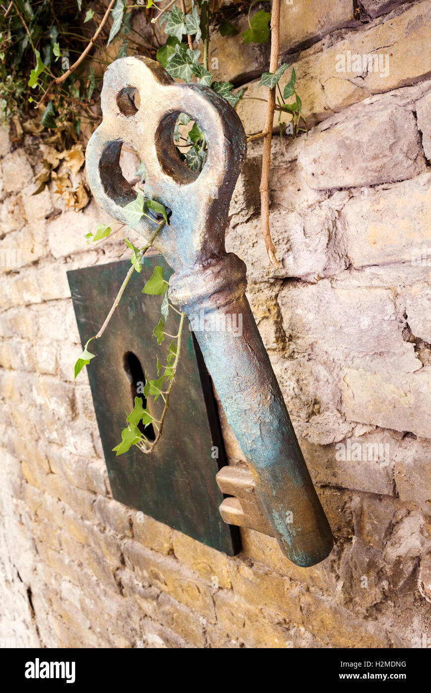Vintage Giant Key And Keyhole On The Brick Wall Stock Photo - Alamy