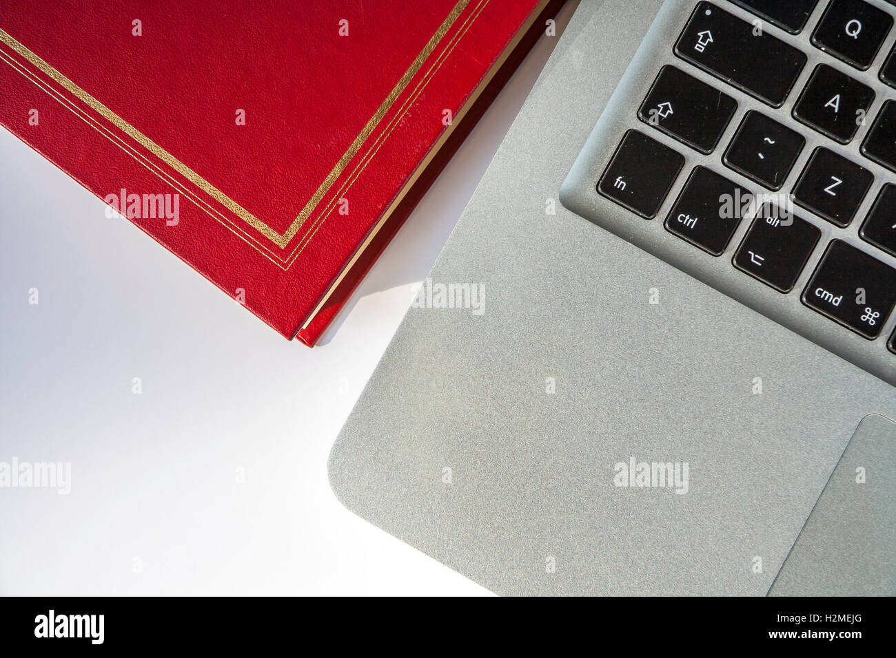 Red Book and the open Laptop Stock Photo - Alamy