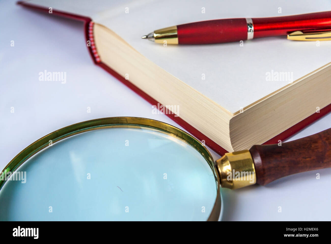 Book magnifying glass concept education hi-res stock photography and ...