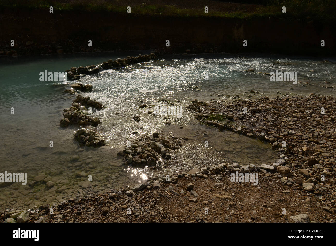 Rocks forming a small pool at Saturnia thermal baths in Italy Stock ...