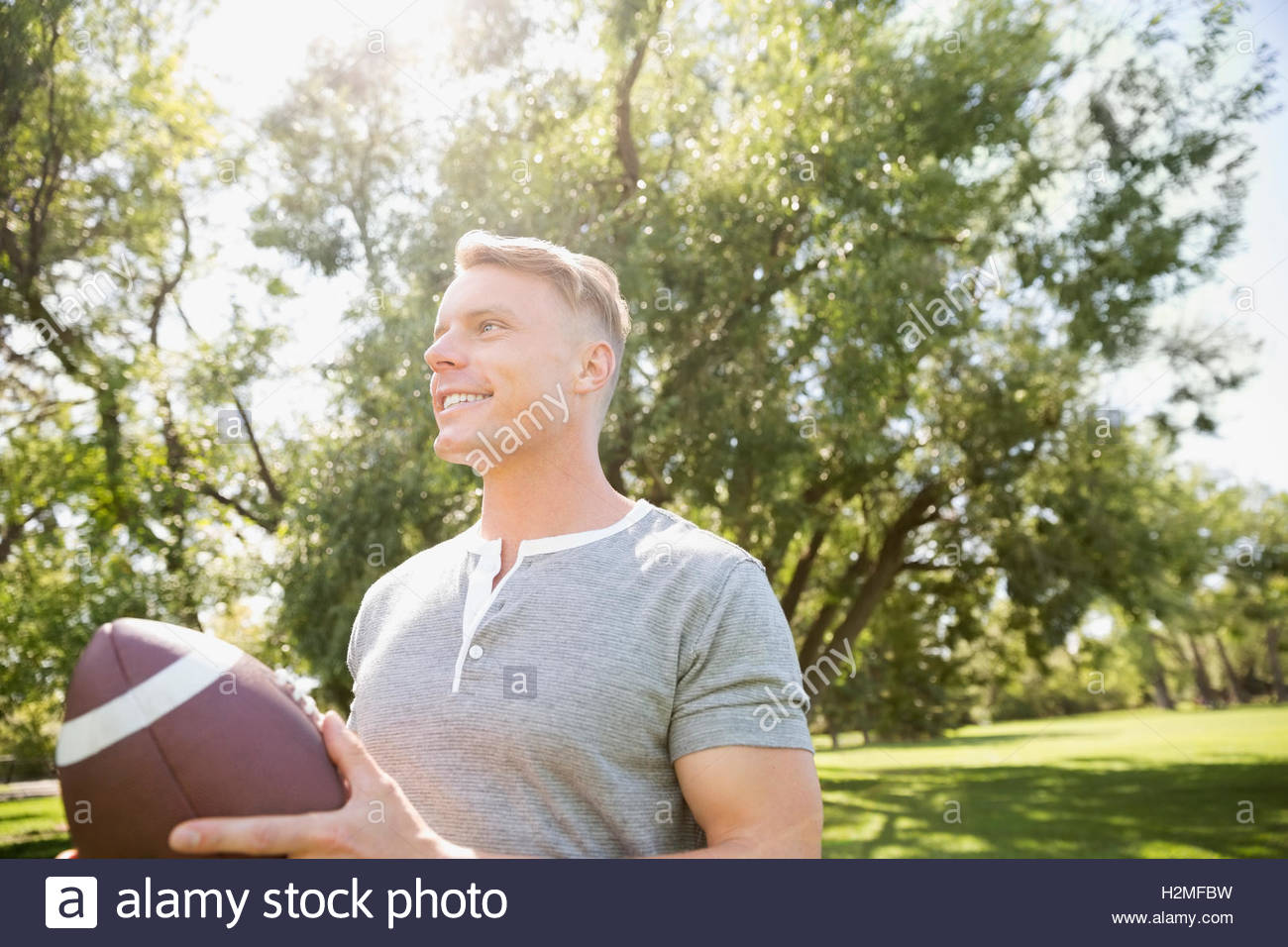 Football smiling hi-res stock photography and images - Alamy