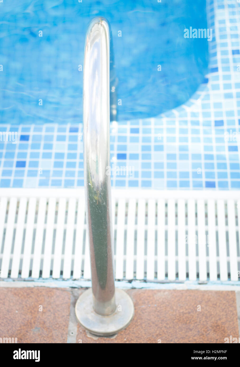 Outdoor swimming pool water on hot summer's day in luxury hotel resort ...