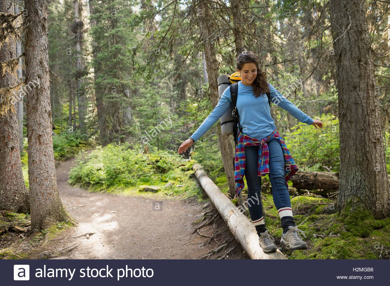 Woman walking woods smiling hi-res stock photography and images - Alamy