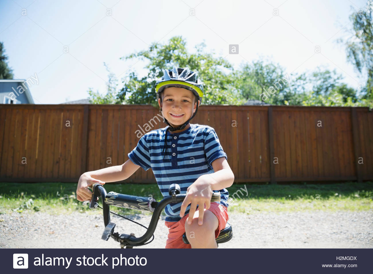 Boy on bicycle wearing helmet hi-res stock photography and images - Alamy