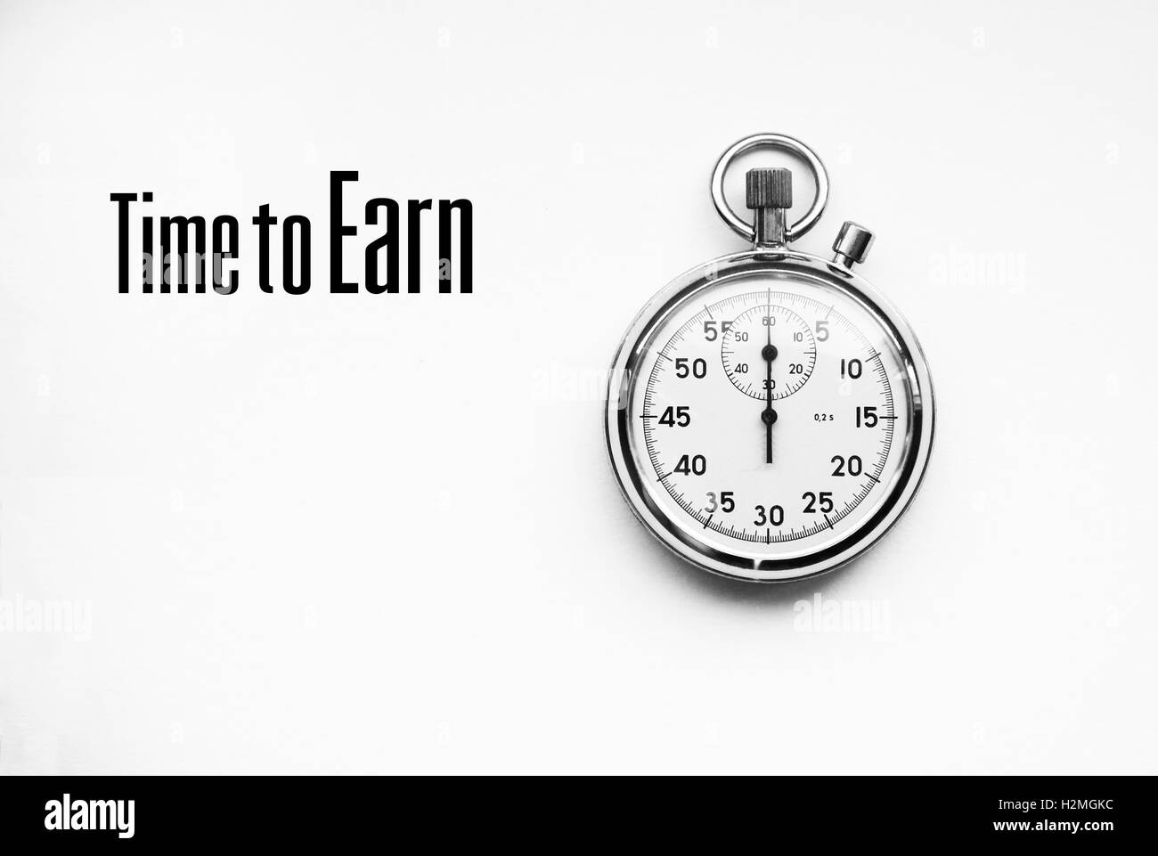 Photo of stopwatch with text quote: Time to Earn Stock Photo - Alamy