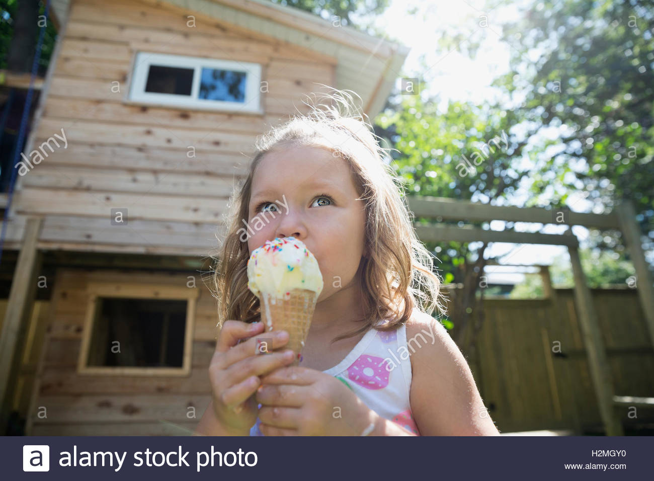 Girl eating messy ice cream hi-res stock photography and images - Alamy