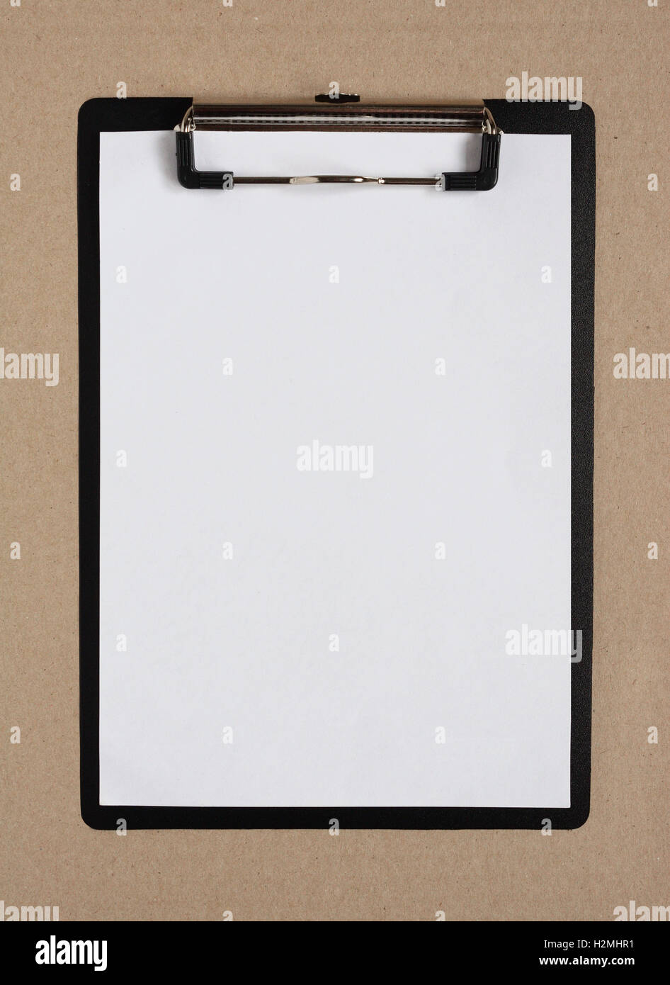 Clipboard with blank sheet of paper on cardboard background Stock Photo ...