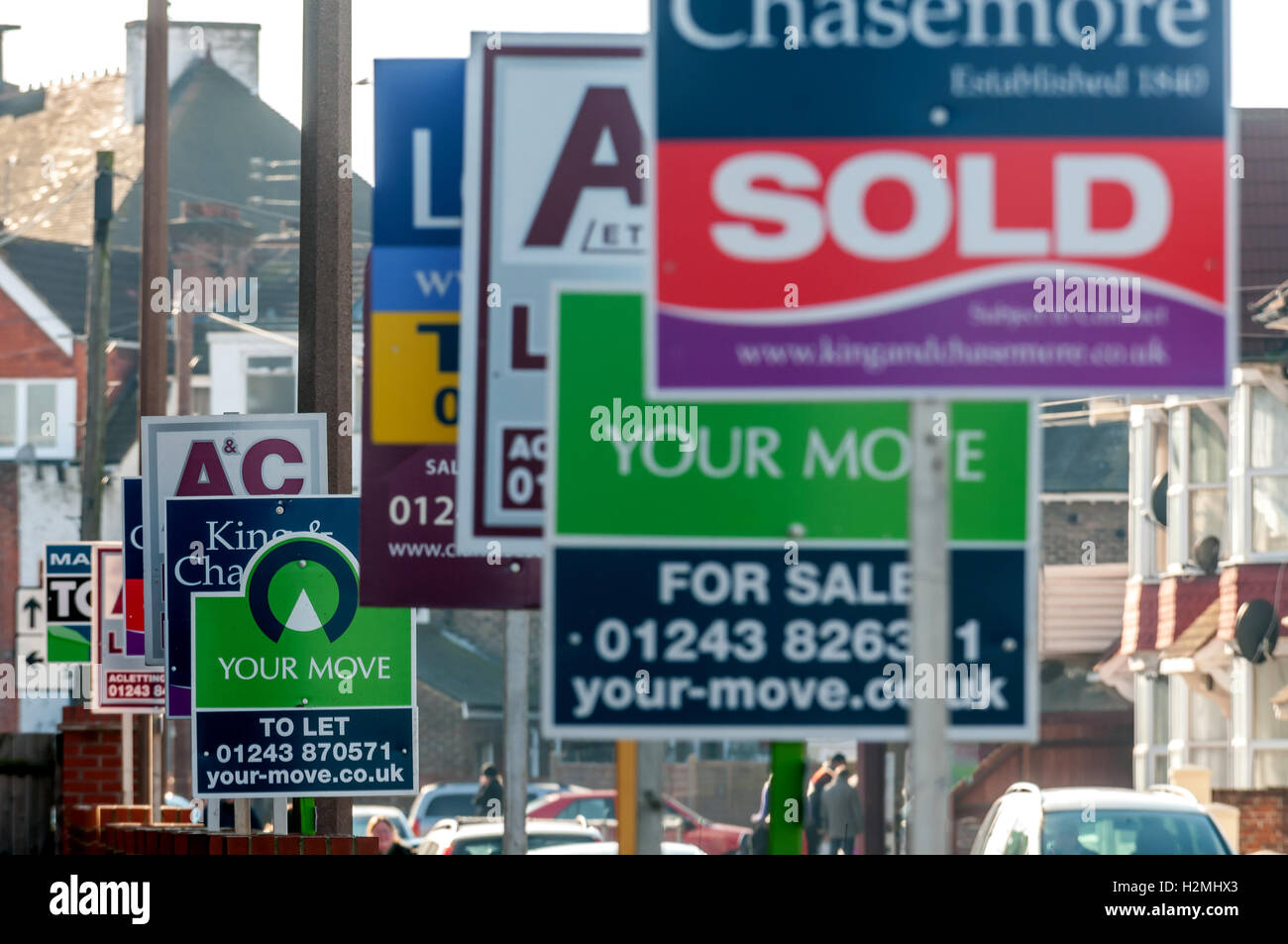 Estate agent boards decorating a street in Littlehampton Stock Photo ...