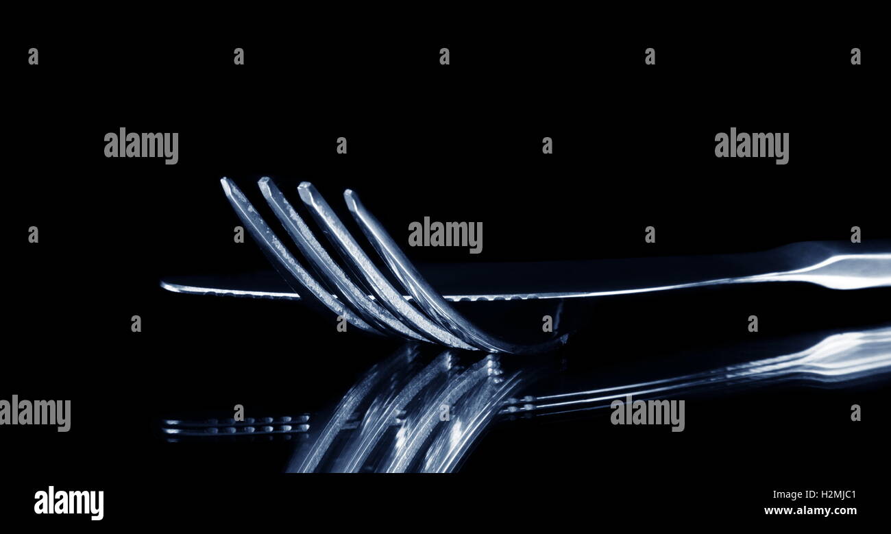 fork and knife on black,shallow DOF Stock Photo - Alamy